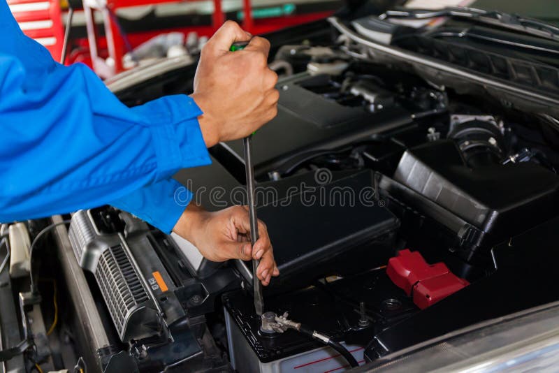 Mechanic Checking and Fixing a Broken Car in Car Service Garage Stock ...