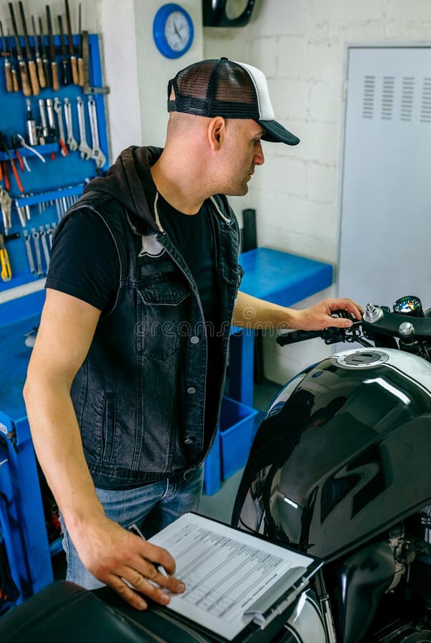 Mechanic Checking Motorcycle Stock Image - Image of repair, custom ...