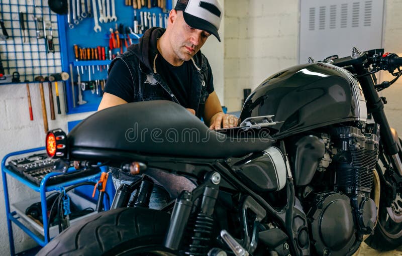 Mechanic Checking Motorcycle Stock Photo - Image of checking, bike ...