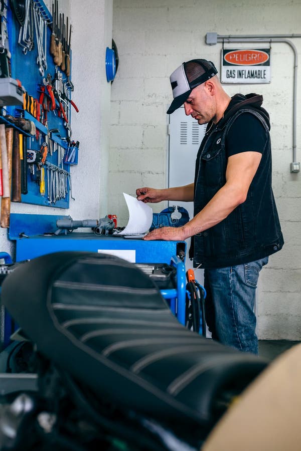 Mechanic Checking Motorcycle Stock Photo - Image of mechanic, bike ...