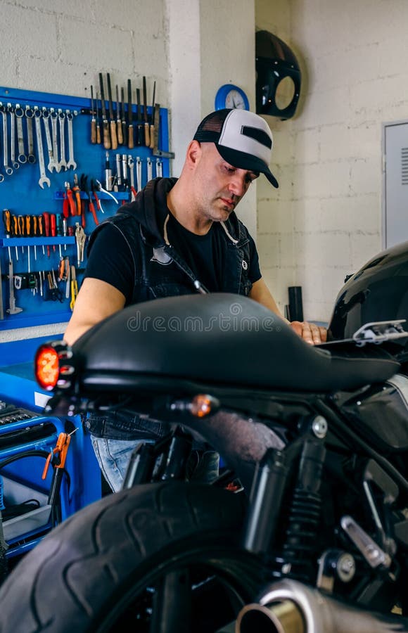 Mechanic Checking Motorcycle Stock Image - Image of handmade, real ...