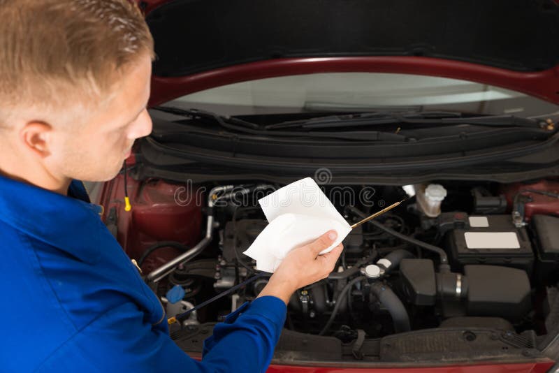 Mechanic Checking Oil Level in Car Engine Stock Image - Image of ...