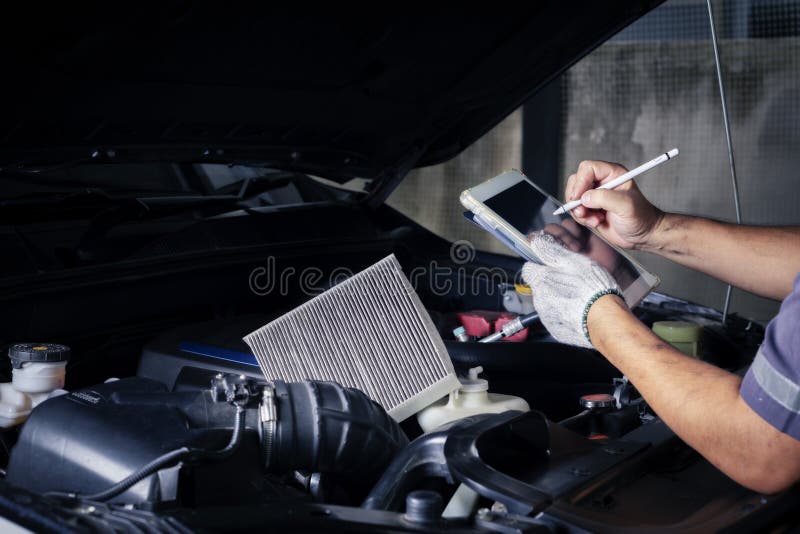 The Mechanic Checks the Engine Using Tablet Computer Technology ...