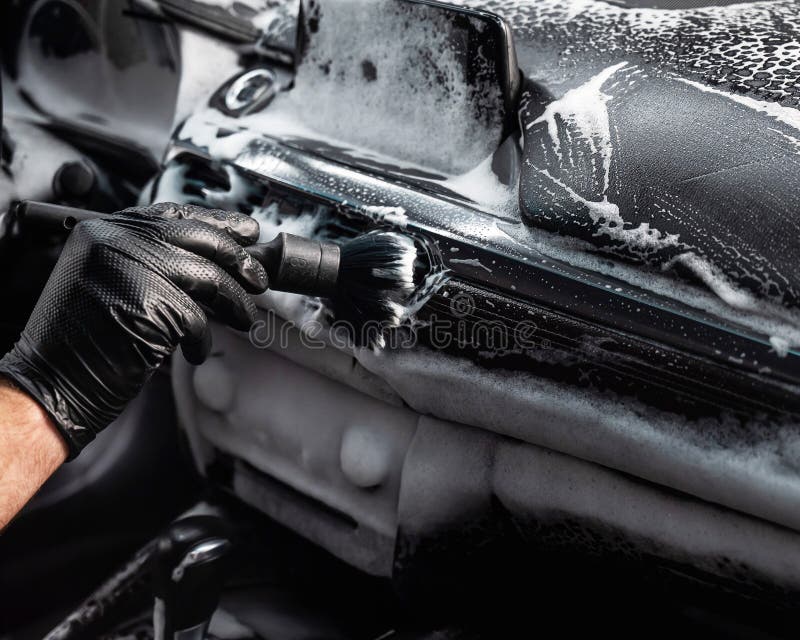 A Mechanic Cleans the Interior of a Car with a Brush and Foam. Stock ...