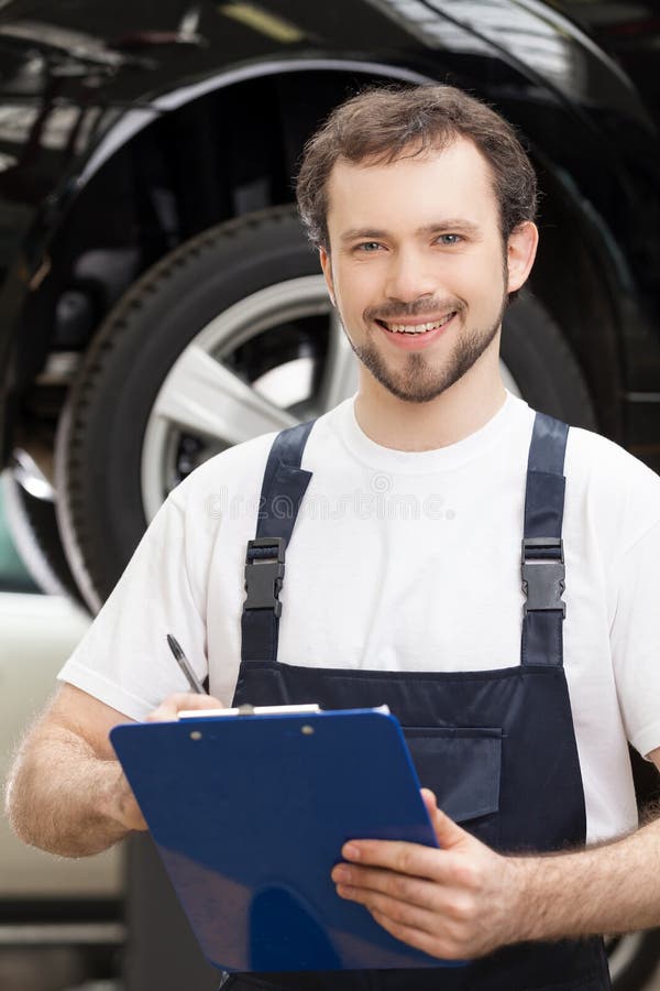 Mechanic with clipboard. stock image. Image of positivity - 32808775