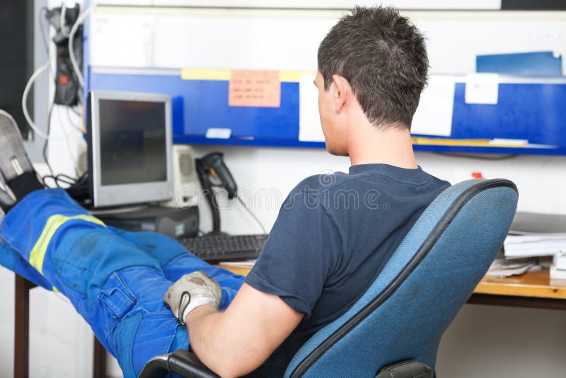 Mechanic at Desk stock photo. Image of customer, office - 20299768