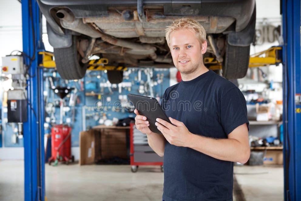 Mechanic with Digital Tablet Stock Photo - Image of adult, inspection ...
