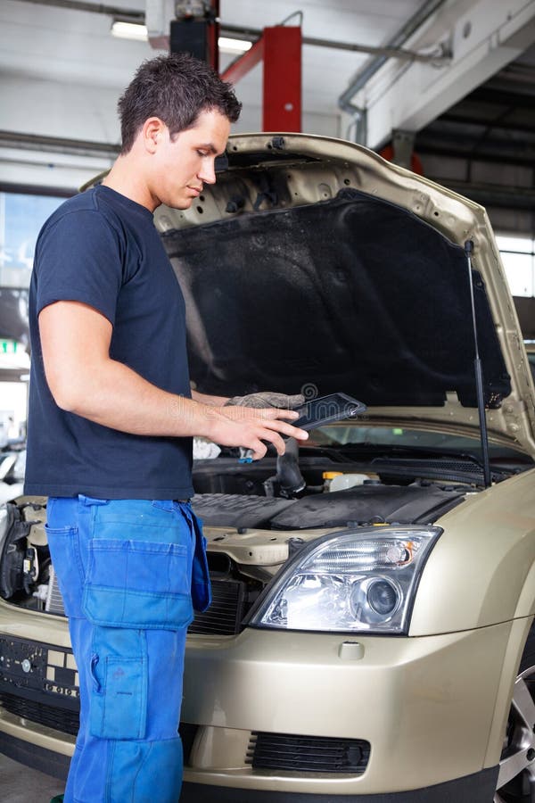 Mechanic with Digital Tablet Stock Photo - Image of adult, inspection ...