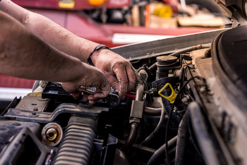 Mechanic with Dirty Hands Works on Car Engine. Authentic Shot of Real ...