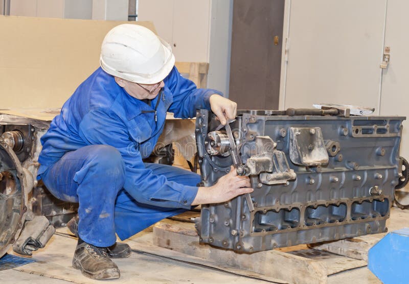The Mechanic Does Detail Measurement before Engine Repair Stock Photo ...