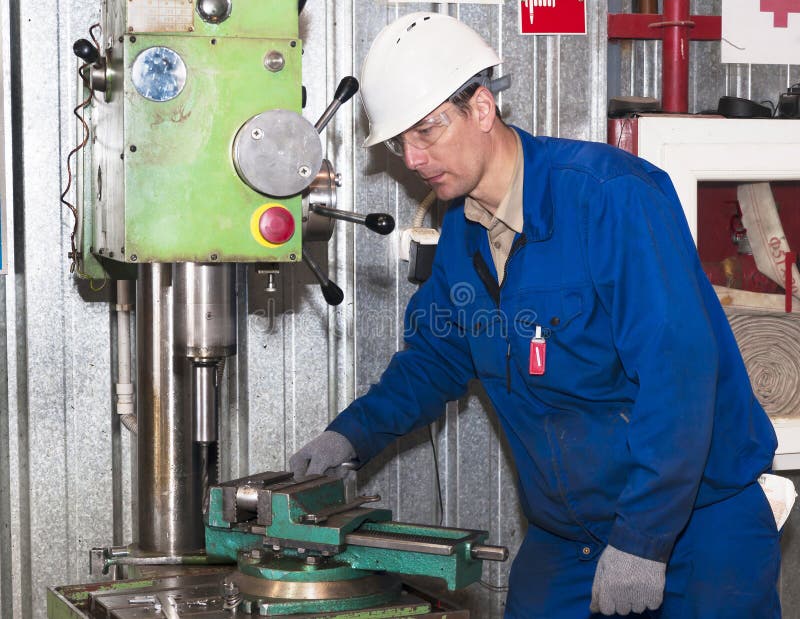 The Mechanic Works at the Machine Stock Photo - Image of mechanician ...