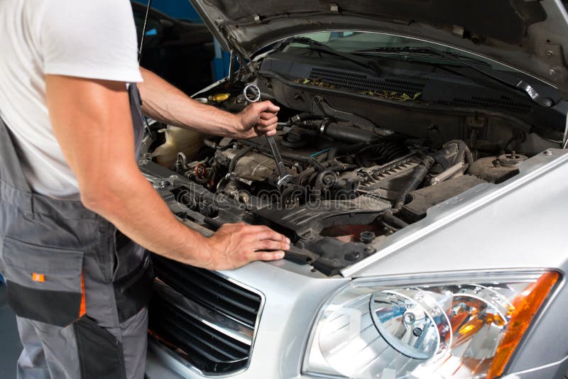 Mechanic engine repair stock image. Image of mechanic - 73439627