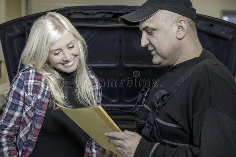 Mechanic explaining repair stock photo. Image of carhood - 29250170