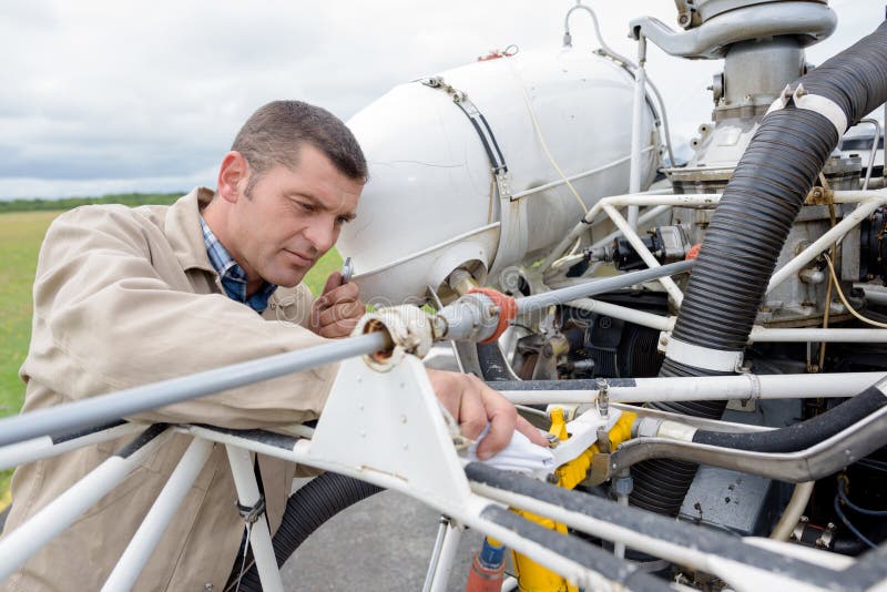 Mechanic Fixing Airplane Outdoors Stock Image - Image of service ...