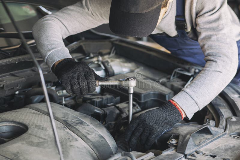 The Mechanic Fixing the Car Stock Image - Image of people, tool: 270587207