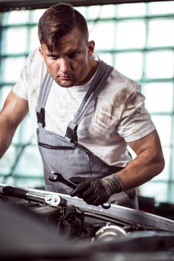 Mechanic Fixing Car Problem Stock Image - Image of baffled, caucasian ...