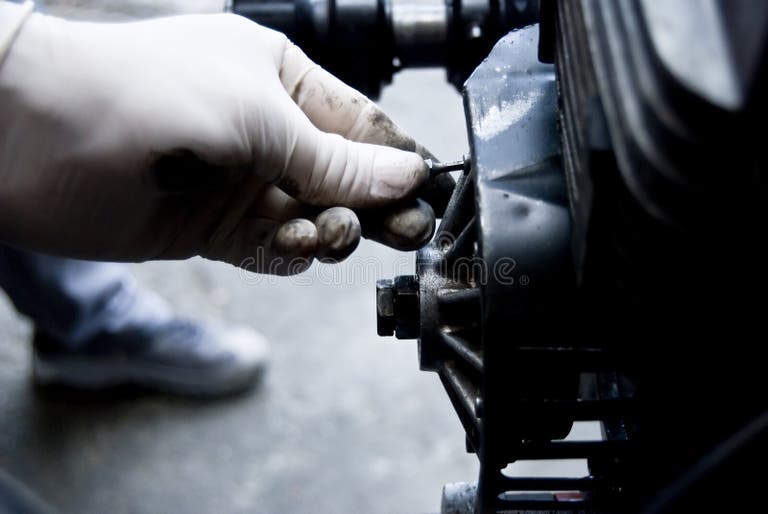 Mechanic fixing an engine stock photo. Image of combustion - 4078678