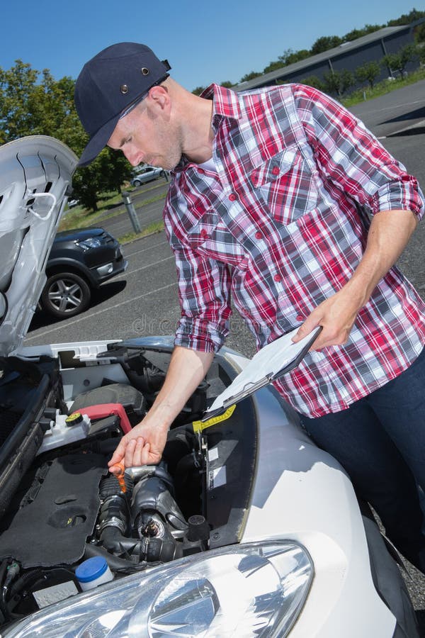Mechanic fixing engine van stock photo. Image of manual - 103883902