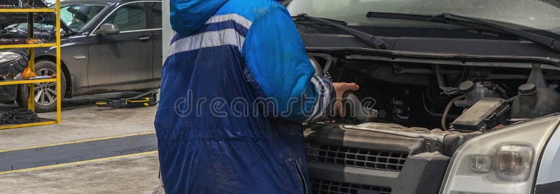 Mechanic Fixing the Engine of a Van Stock Image - Image of expertise ...