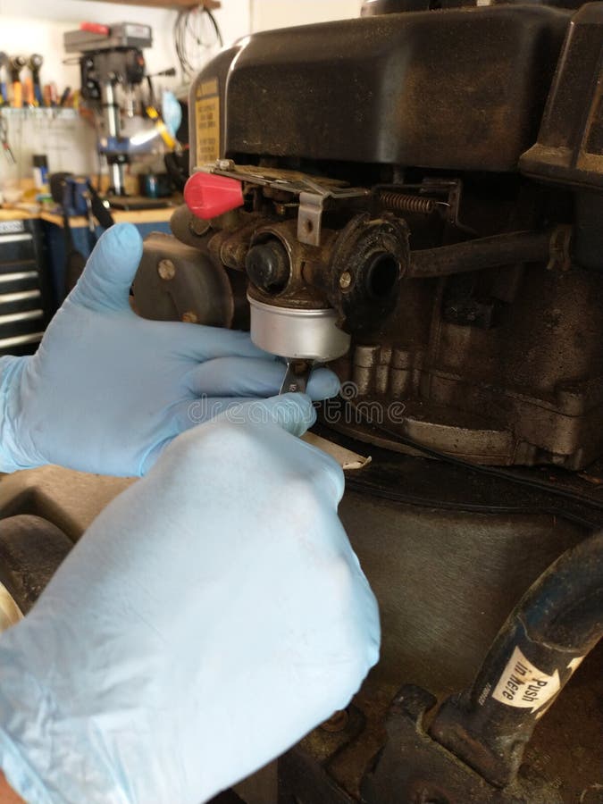 Mechanic Fixing the Lawn Mower Stock Image - Image of motor, gloves ...