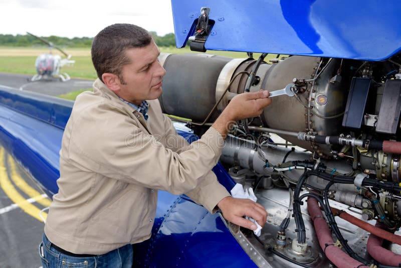 Mechanic Fixing Motor Plane Stock Photo - Image of club, technology ...