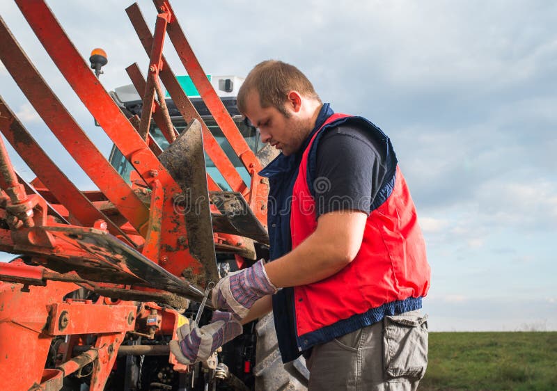 Mechanic Fixing Plow on the Tractor Stock Image - Image of nature ...