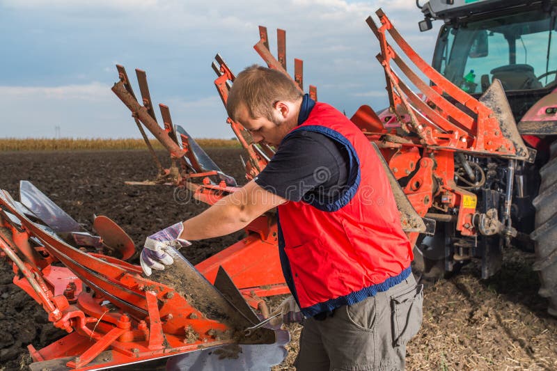 Mechanic Fixing Plow on the Tractor Stock Photo - Image of wrench ...