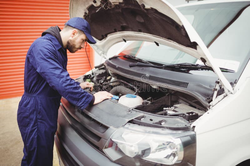 Mechanic fixing a van stock photo. Image of mechanic - 67726686