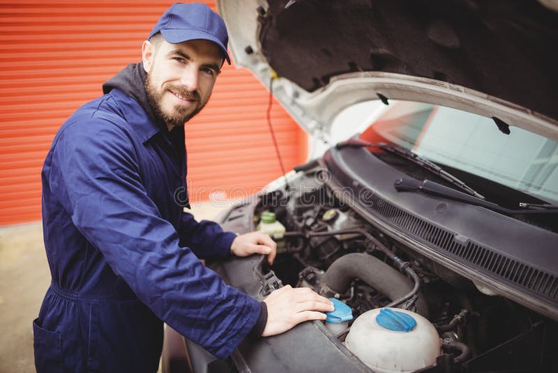 Mechanic fixing a van stock photo. Image of expertise - 67726730
