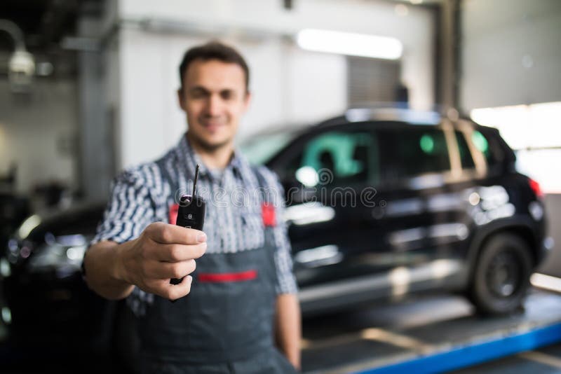 Mechanic Handling Keys of a Car at the Service Garage Stock Image ...