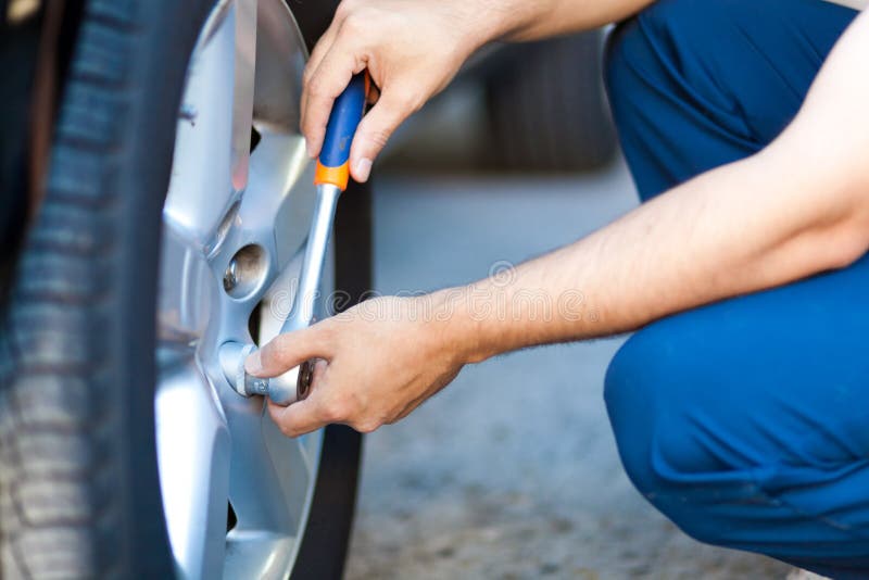 Mechanic in His Workshop Changing Tires or Rims Stock Image - Image of ...