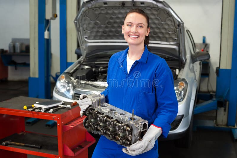 Mechanic Holding an Engine and Smiling Stock Photo - Image of hood ...
