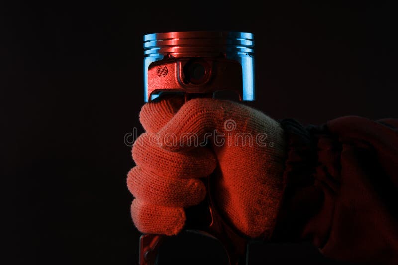 Mechanic Holding Piston from Engine on Dark Background Stock Photo ...