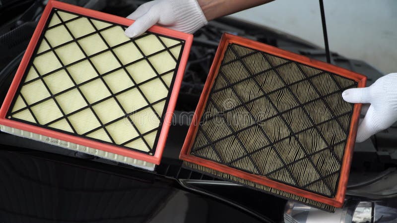 Mechanic Holds a New Car Air Filter To Replace the Old Car Filter ...