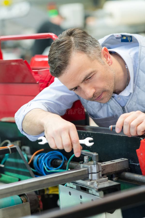 Mechanic Holds Spanner Tool Stock Image - Image of garage, male: 149659967