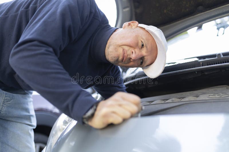 Mechanic Checking a Car Engine Compartment Stock Photo - Image of ...