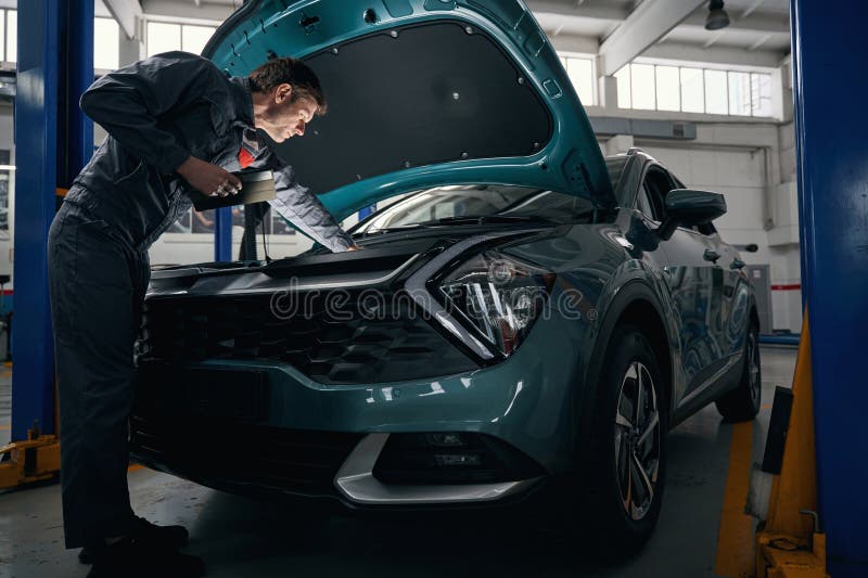 Mechanic Inspecting Technical Condition of Car Engine Stock Image ...