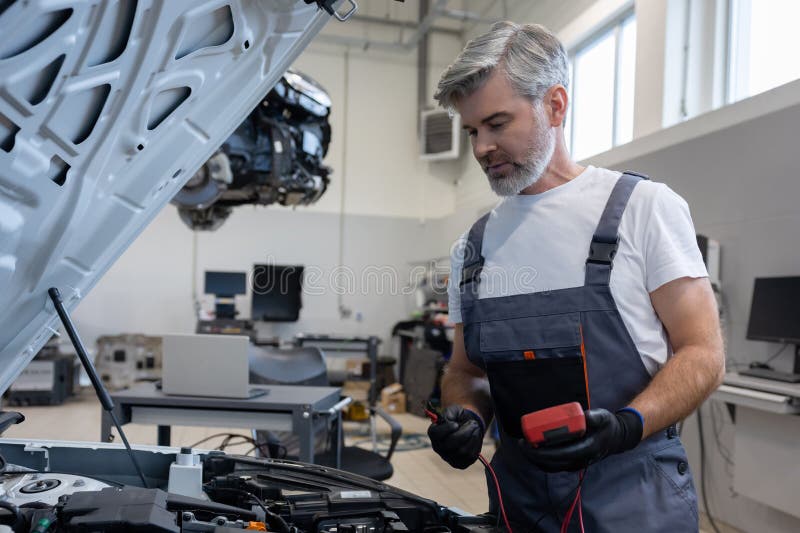 Mechanic with Laptop in Auto Repair Workshop Stock Photo - Image of ...