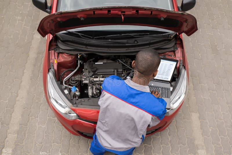 Mechanic with Laptop while Examining Engine Stock Image - Image of ...