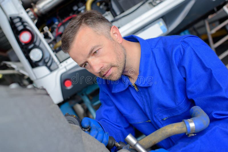 Mechanic machinist at work stock image. Image of detail - 257191981