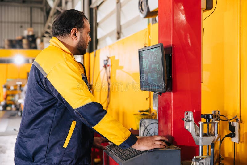 Mechanic Male Worker Using Advance Computer Technology for Tuning ...