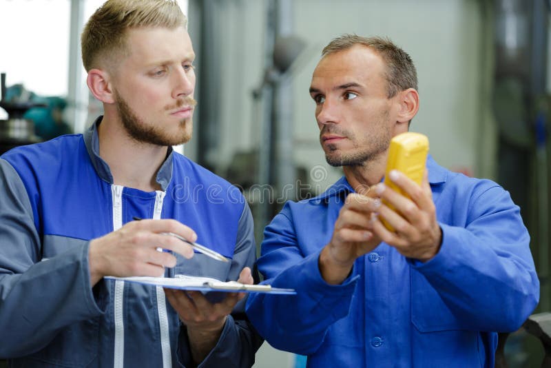 Mechanic Man with Digital Multimeter Testing Ignition Coil Stock Image ...