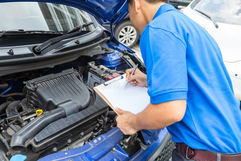 Mechanic Man Holding Clipboard and Check the Car Stock Photo - Image of ...