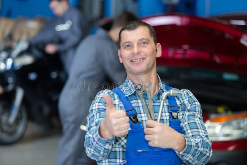 Mechanic Man Holding Wrench Stock Photo - Image of diagnostic, truck ...