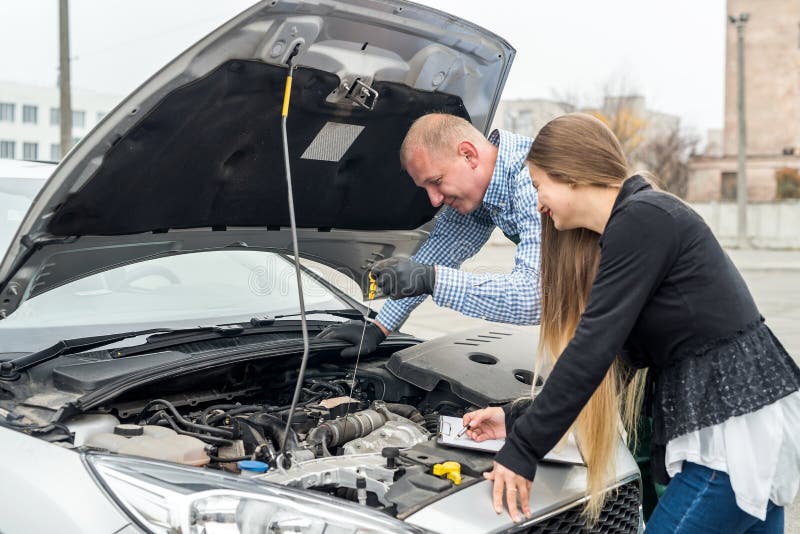 Mechanic Man Inspecting Car Engine with Customer Stock Photo - Image of ...