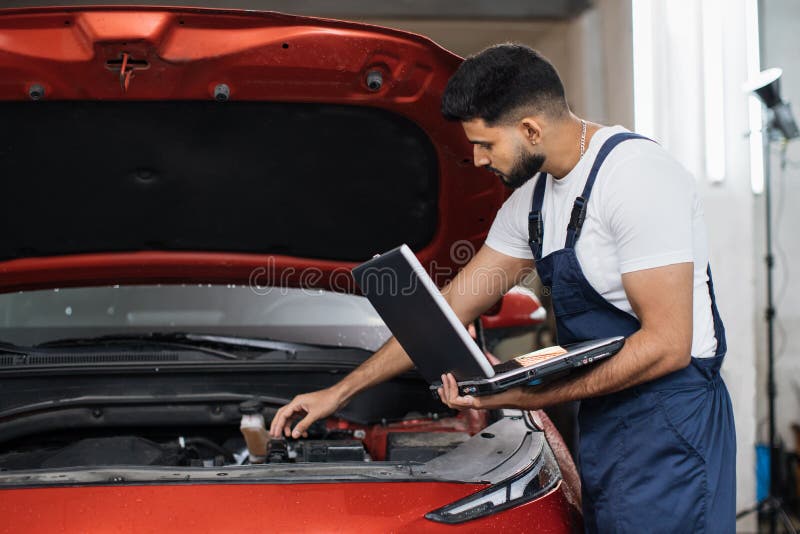 Mechanic Man Mechanic Manager Worker Using a Laptop Computer Checking ...