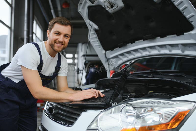 Mechanic Man Mechanic Manager Worker Using a Laptop Computer Checking ...