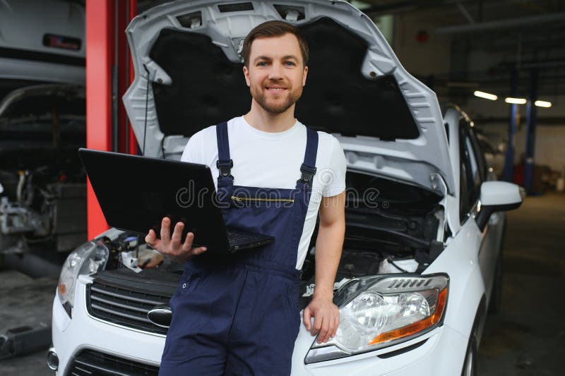 Mechanic Man Mechanic Manager Worker Using a Laptop Computer Checking ...