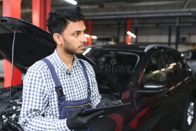 Mechanic Man Mechanic Manager Worker Using a Laptop Computer Checking ...
