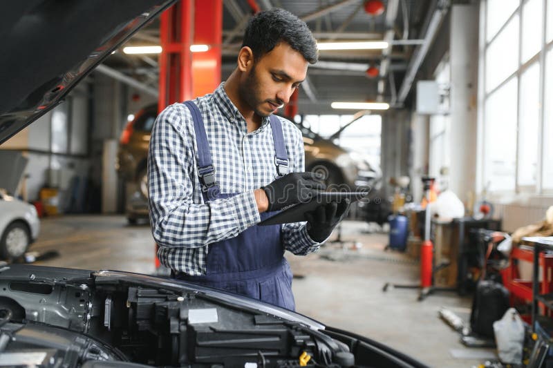Mechanic Man Mechanic Manager Worker Using a Laptop Computer Checking ...
